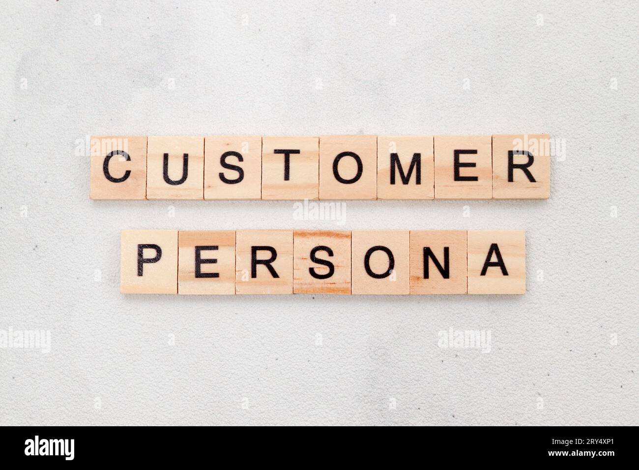 Top view of Customer Persona word on wooden cube letter block on white ...