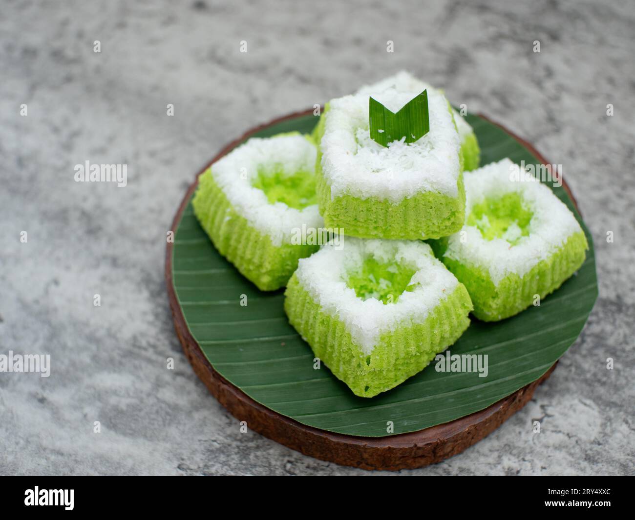 Putri Ayu is a sweet green cake topped with grated coconut, a popular ...