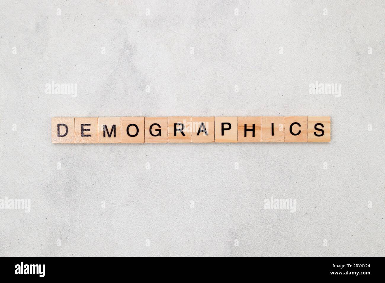 Top view of Demographics word on wooden cube letter block on white ...