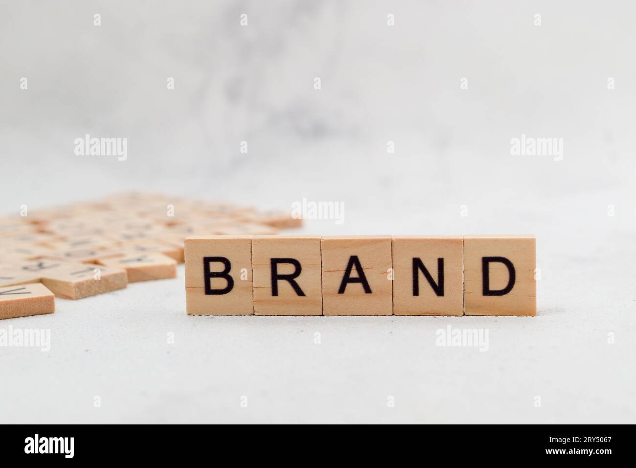 Top view of Brand word on wooden cube letter block on white background ...