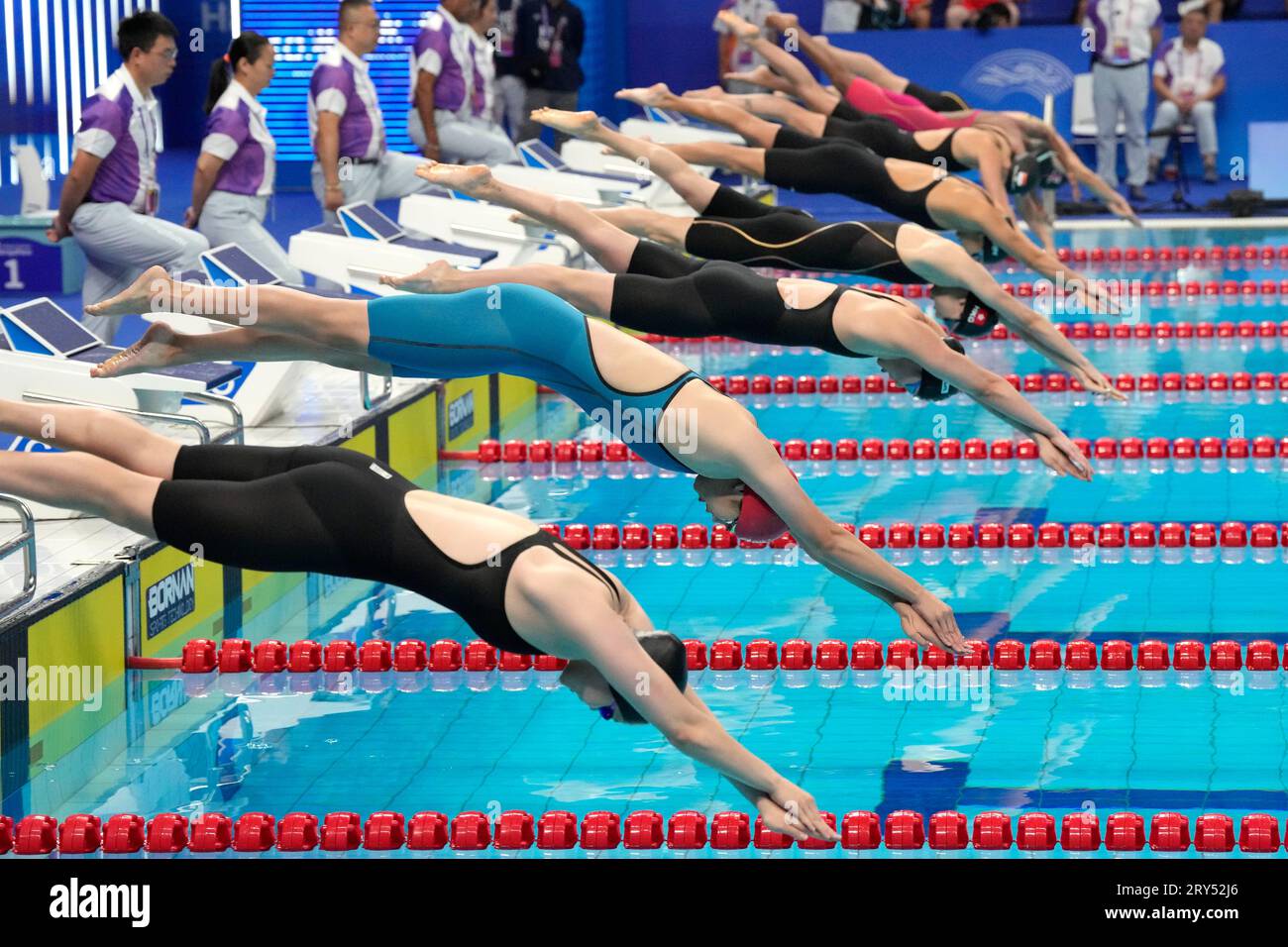 Swimmers compete during the women's 50m butterfly swimming heat at the ...