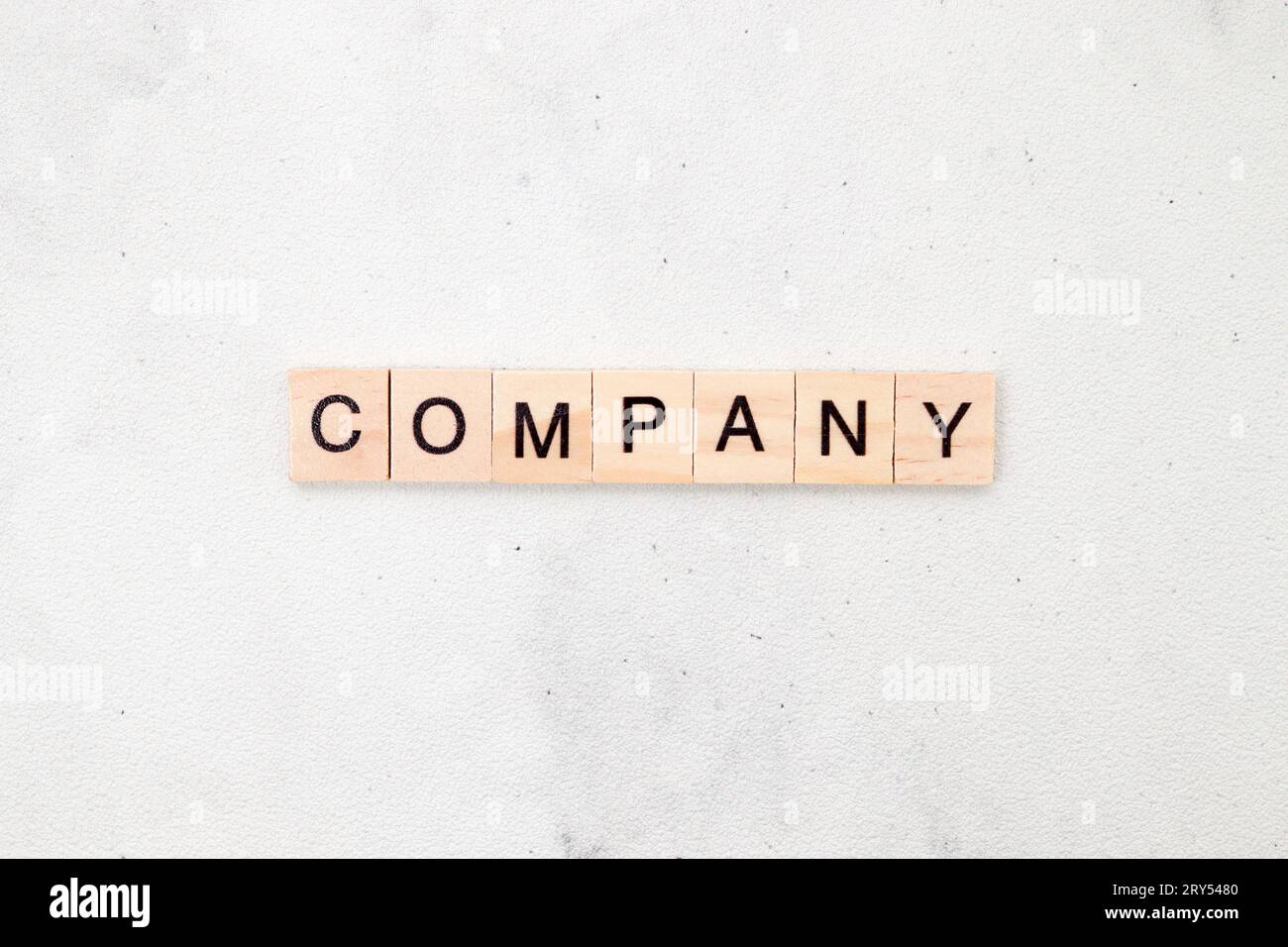 Top view of Company word on wooden cube letter block on white ...