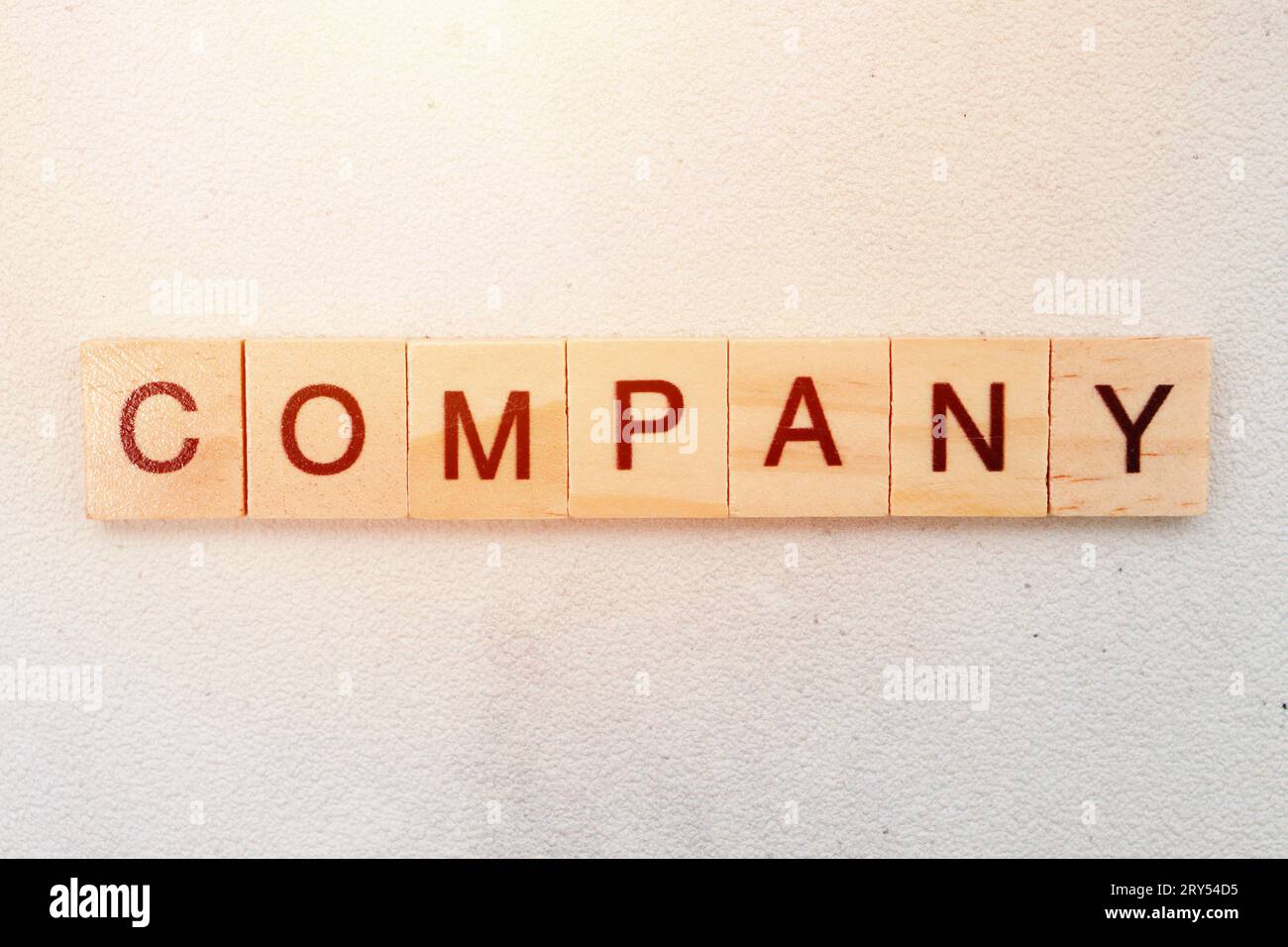 Top view of Company word on wooden cube letter block on white ...