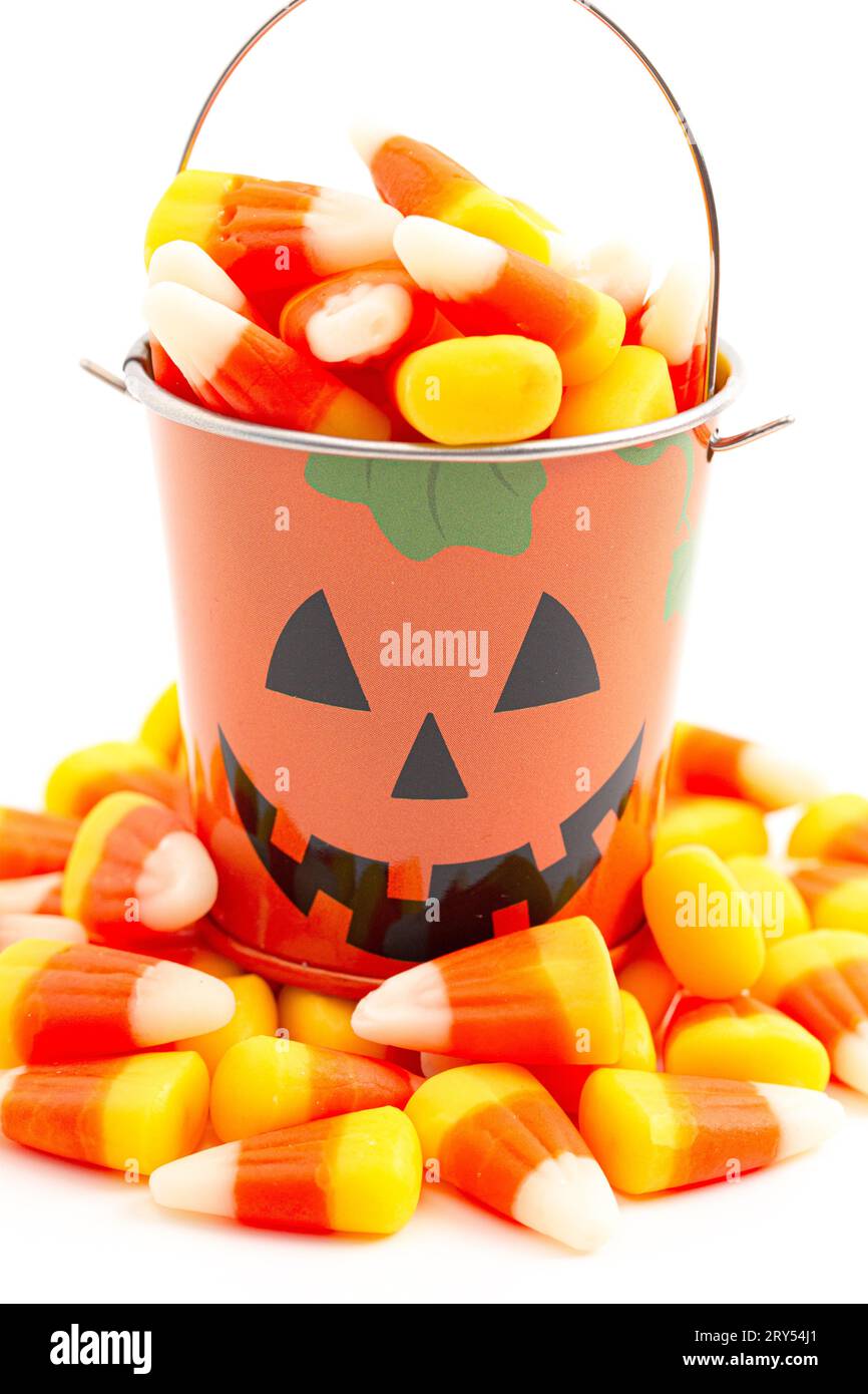 Tin Pumpkin Jack O Lantern Bucket FIlled with Candy Corn Isolated on a ...