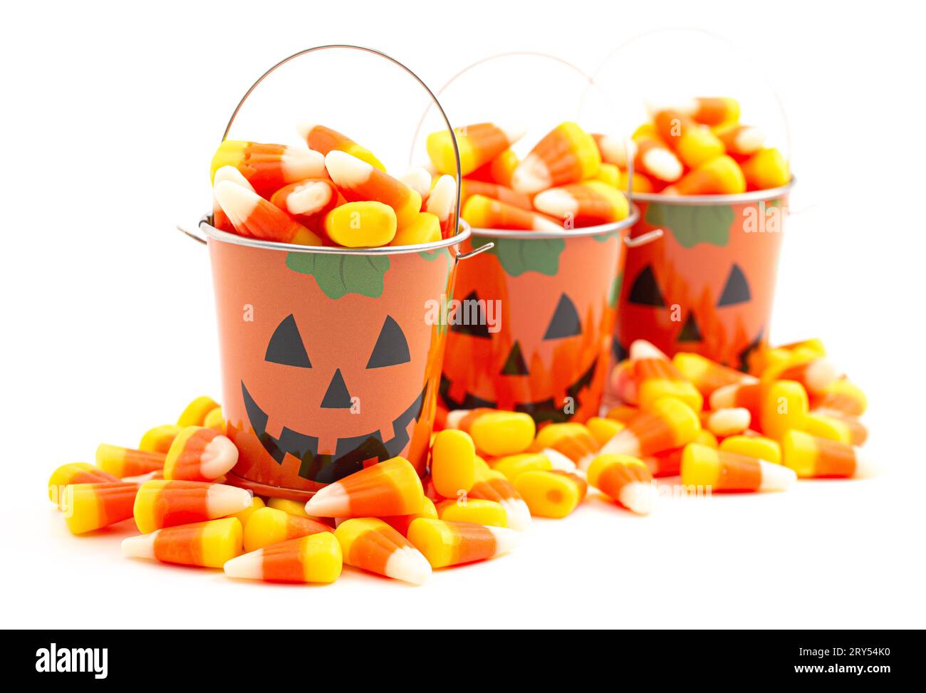 Tin Pumpkin Jack O Lantern Bucket FIlled with Candy Corn Isolated on a ...