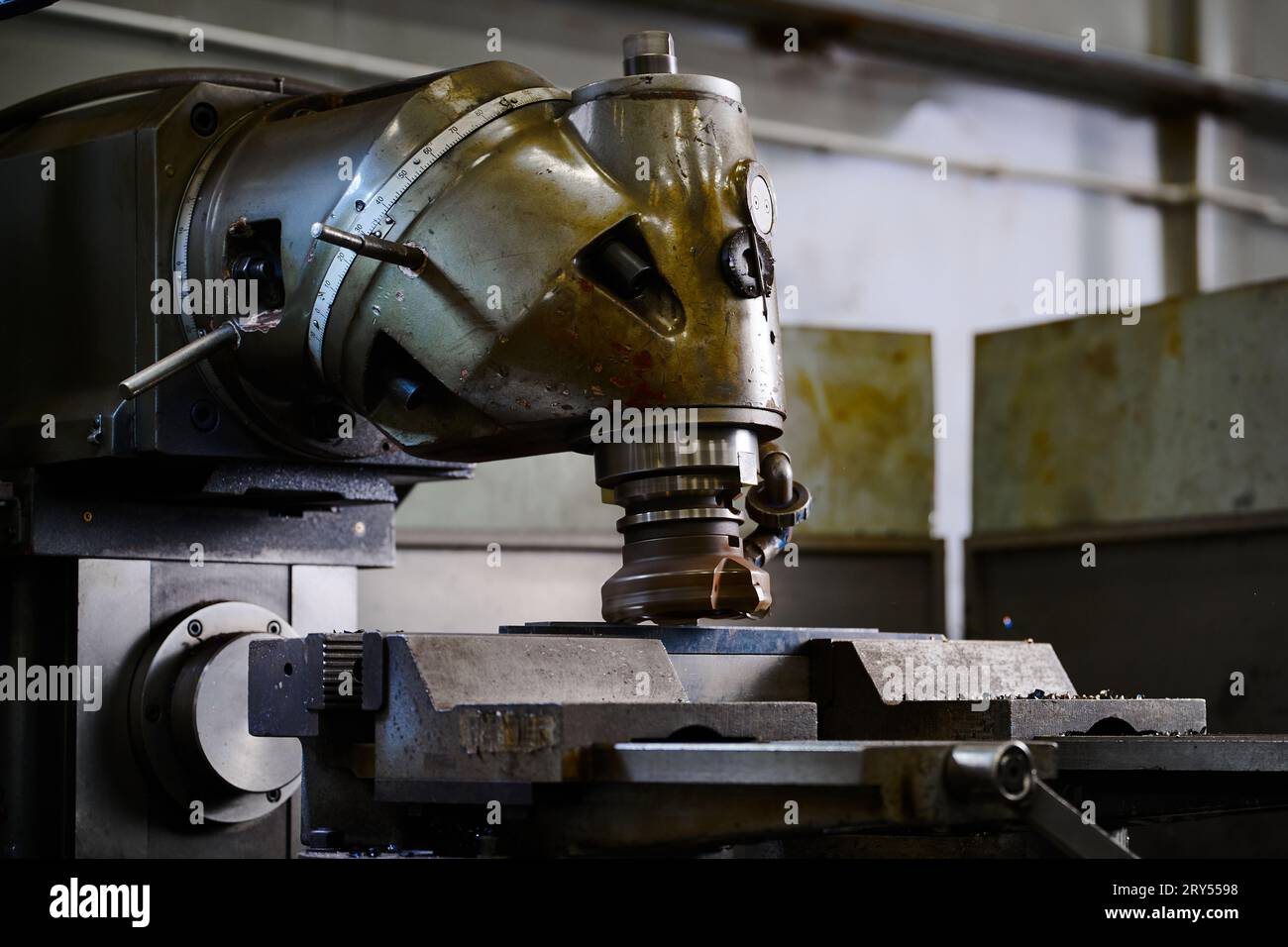 Old vertical milling machine in plant workshop closeup Stock Photo - Alamy