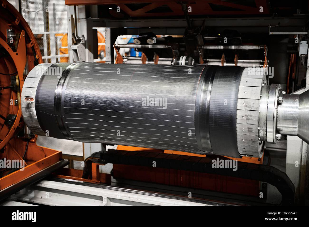 Rubber workpiece on shaft forming tire in factory workshop Stock Photo ...