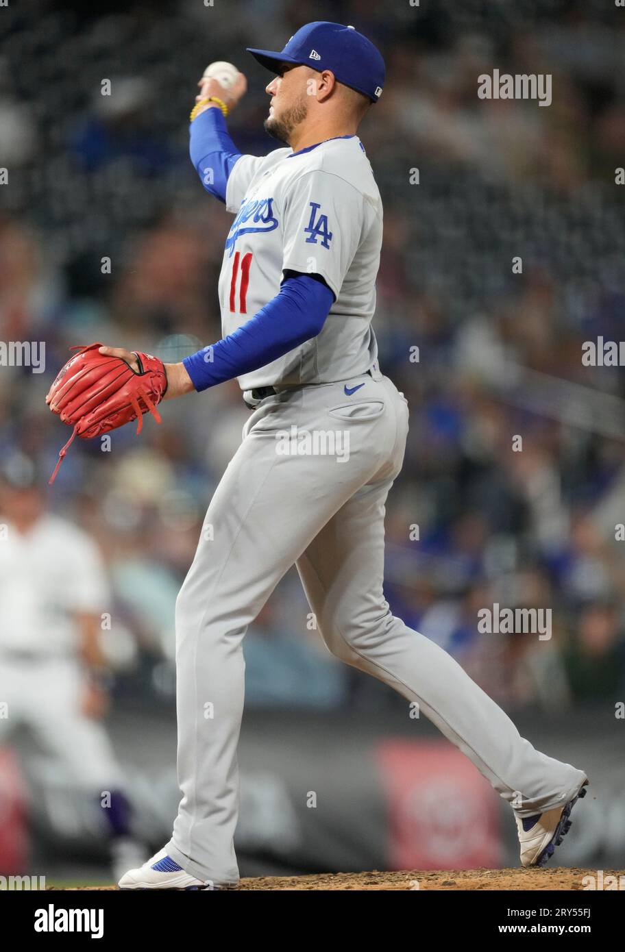 Los Angeles Dodgers infielder Miguel Rojas pitches in relief against ...
