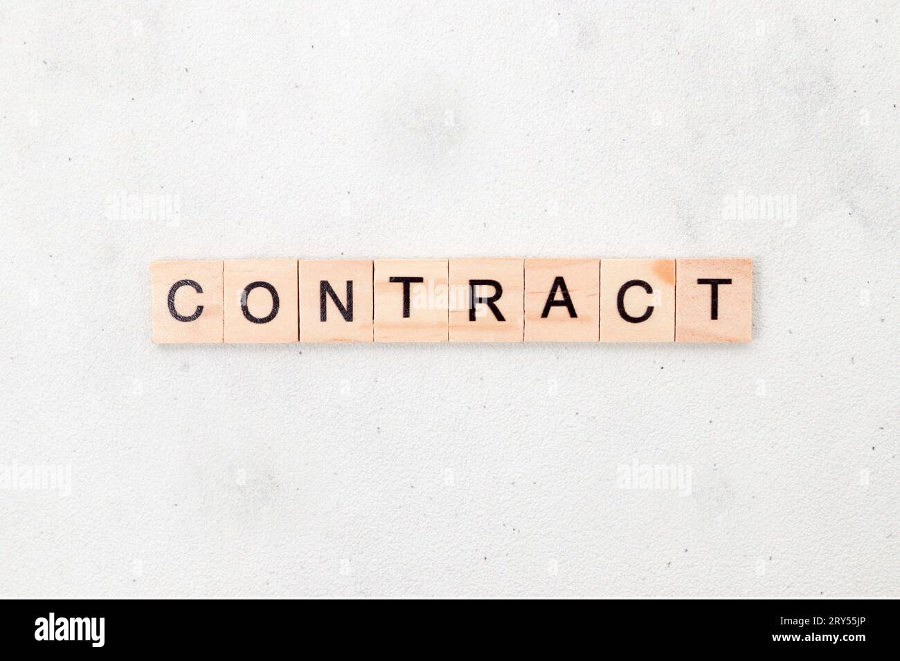 Top view of contract word on wooden cube letter block on white ...