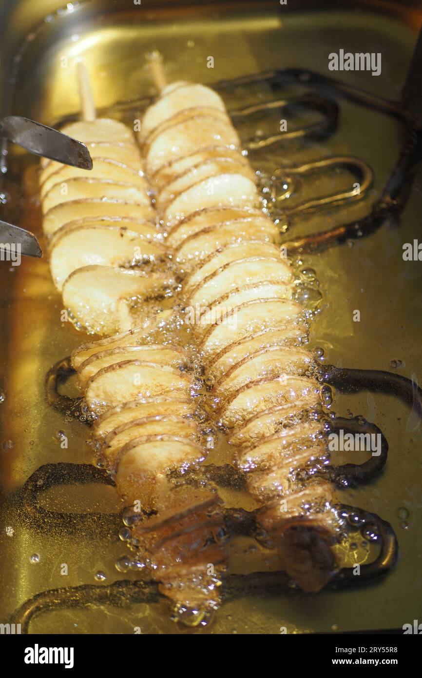 fried chips potatoes frying in boiling hot oil in a deep fryer Stock ...