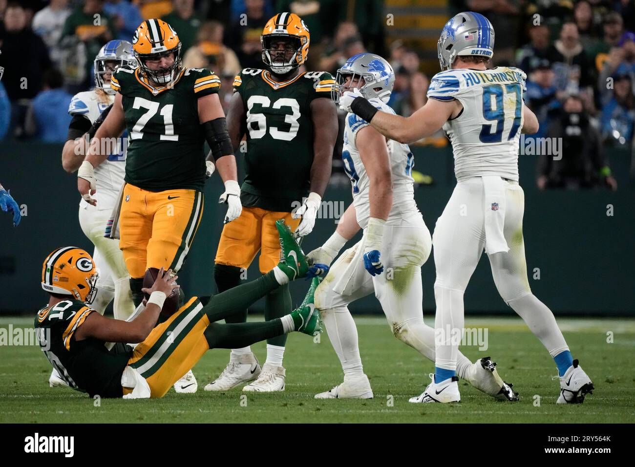 Detroit Lions defensive end John Cominsky (79) celebrates with teammate ...