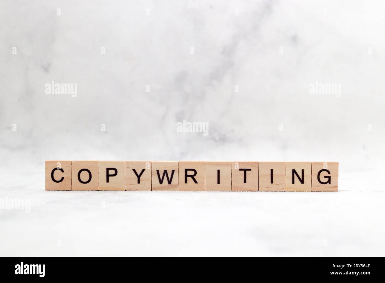 Top view of Copywriting word on wooden cube letter block on white ...