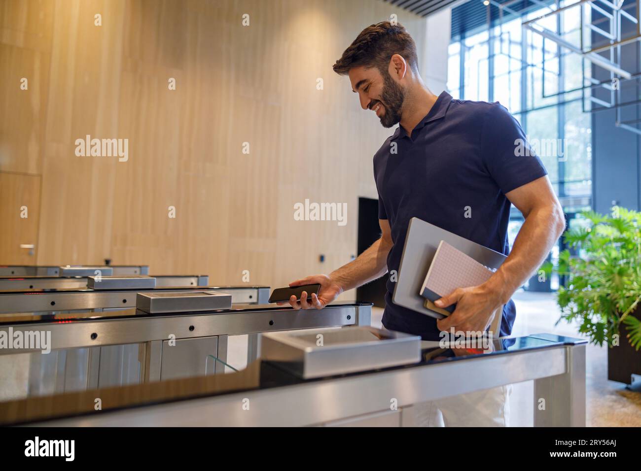 Happy successful businessman or entrepreneur enters office going ...