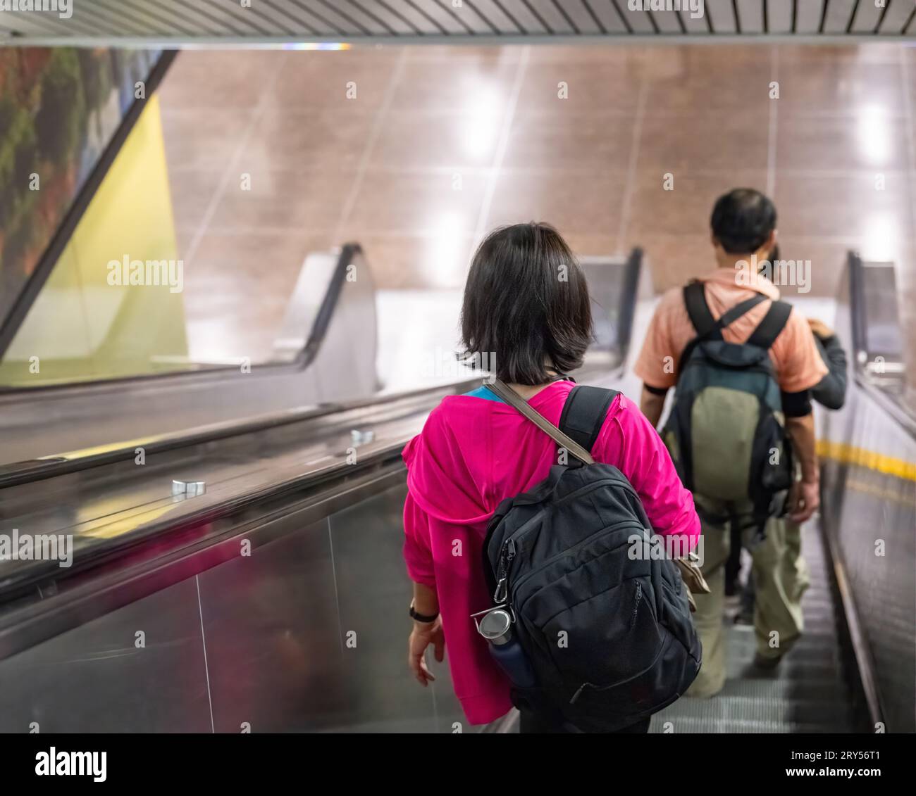 Businessman moving walkway hi-res stock photography and images - Alamy