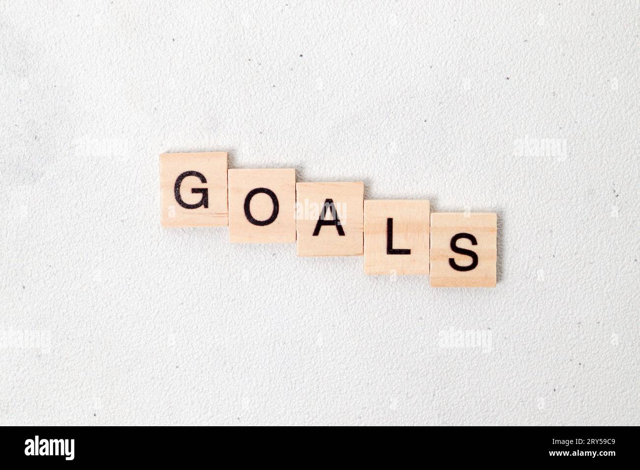 Top view of Goals word on wooden cube letter block on white background ...
