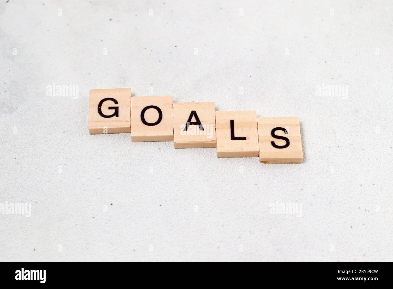 Top view of Goals word on wooden cube letter block on white background ...