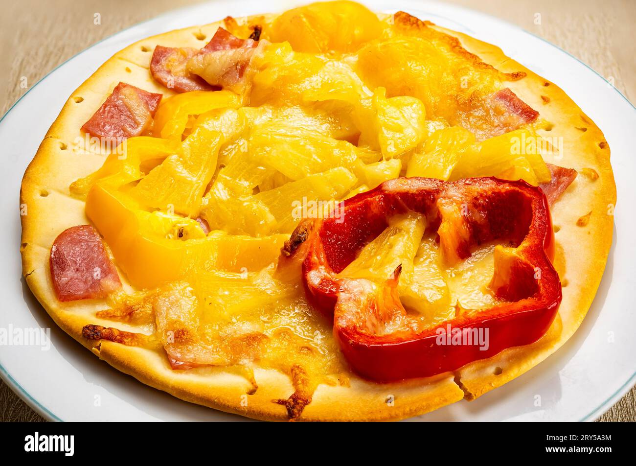 Closeup view of delicious homemade hawaiian pizza topping with pieces ...