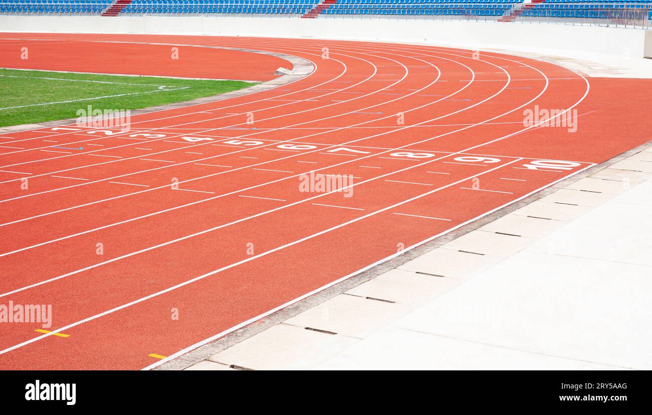 Red running track in outdoor sports stadium Stock Photo - Alamy
