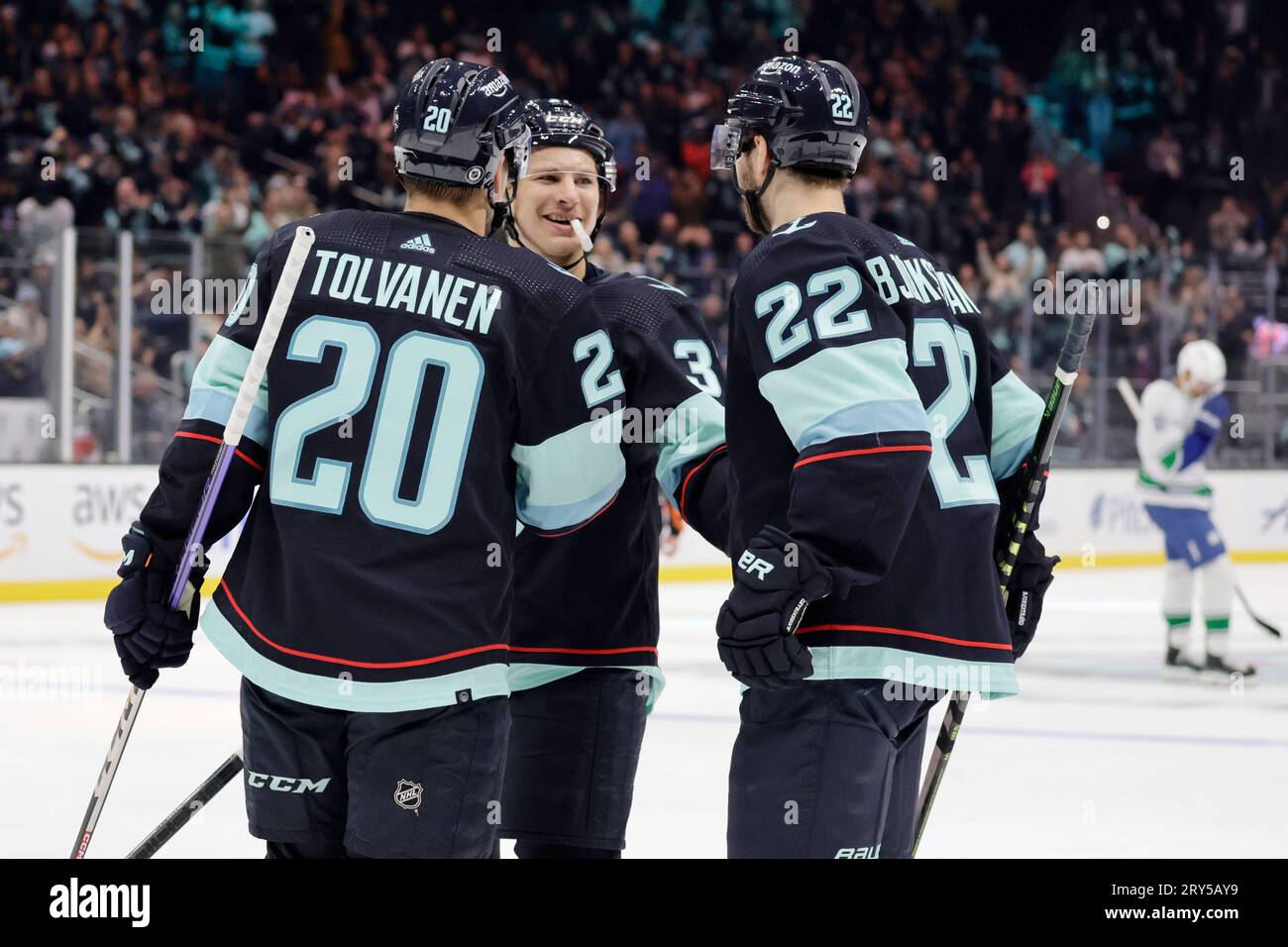 Seattle Kraken right wing Eeli Tolvanen (20) is congratulated by center ...