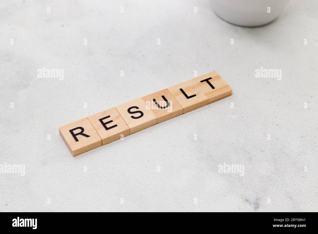 Top view of Result word on wooden cube letter block on white background ...