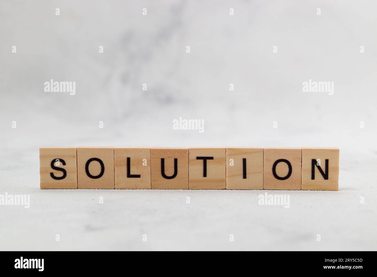 Top view of Solution word on wooden cube letter block on white ...
