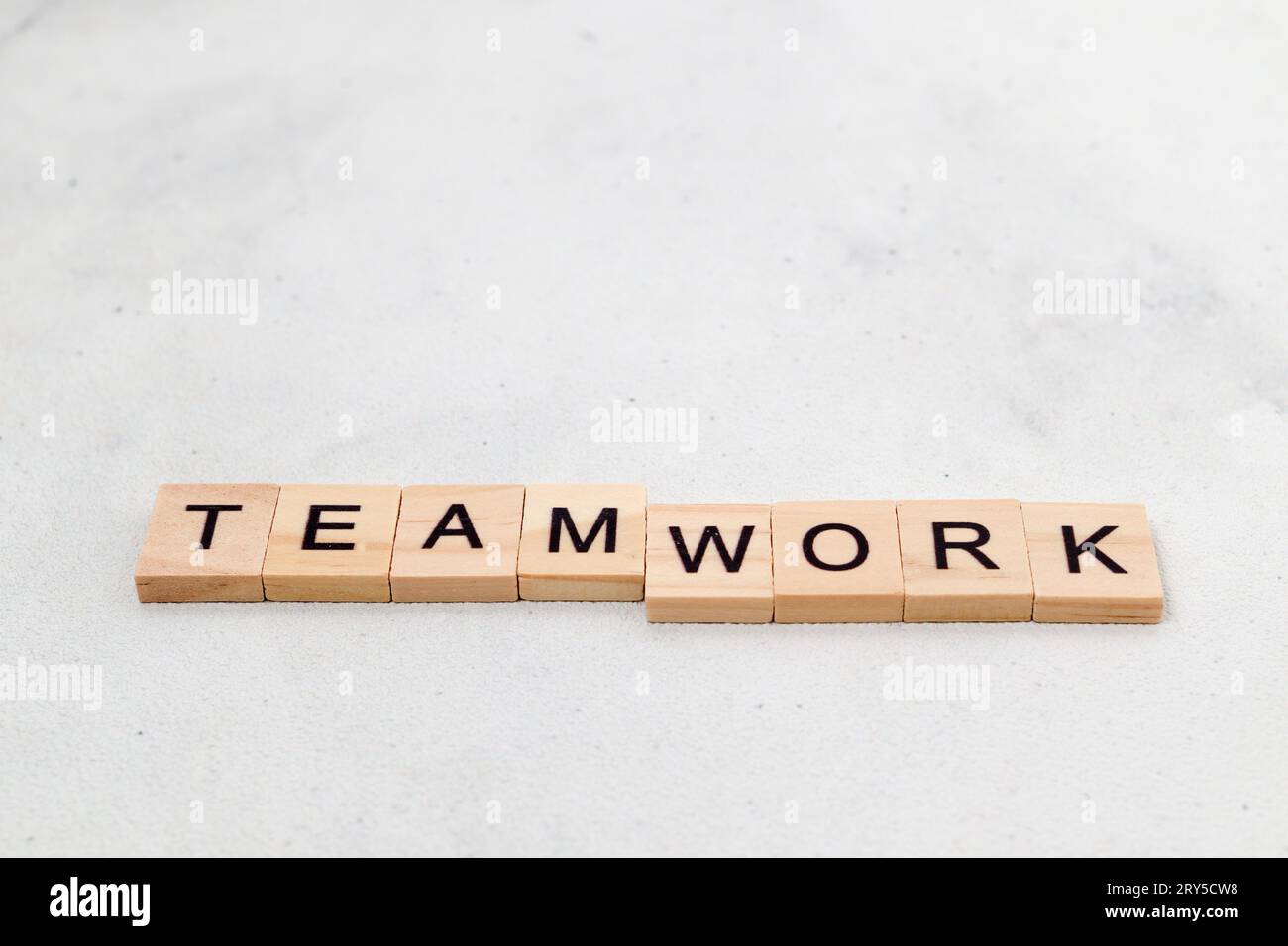 Top view of Teamwork word on wooden cube letter block on white ...