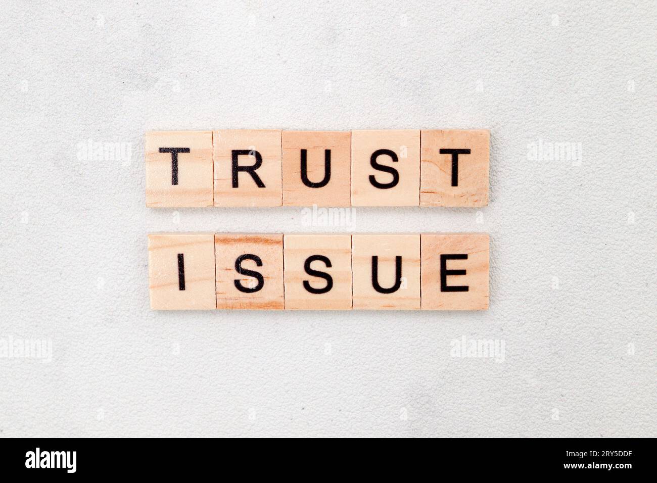 Top view of Trust Issue word on wooden cube letter block on white ...