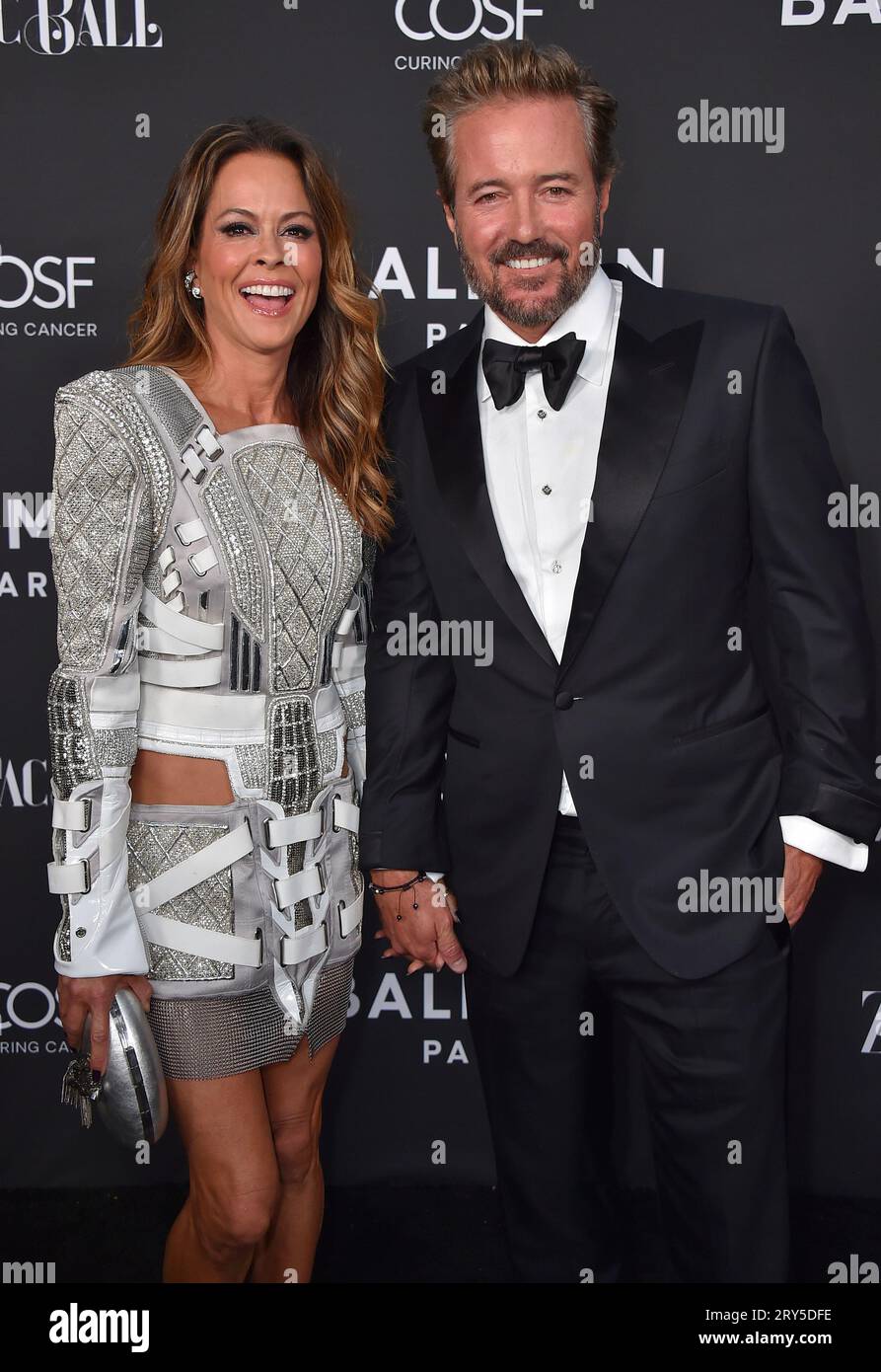 Brooke Burke, left, and Scott Rigsby arrive at the Zodiac Ball ...