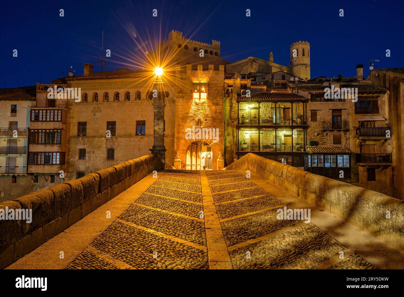 Valderrobres castle and church illuminated at blue hour and at night ...
