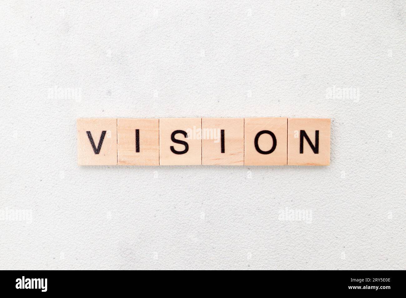 Top view of Vision word on wooden cube letter block on white background ...