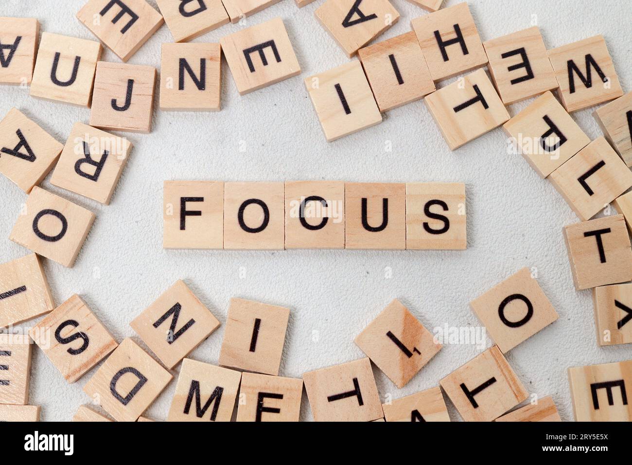 Top view of Focus word on wooden cube letter block on white background ...