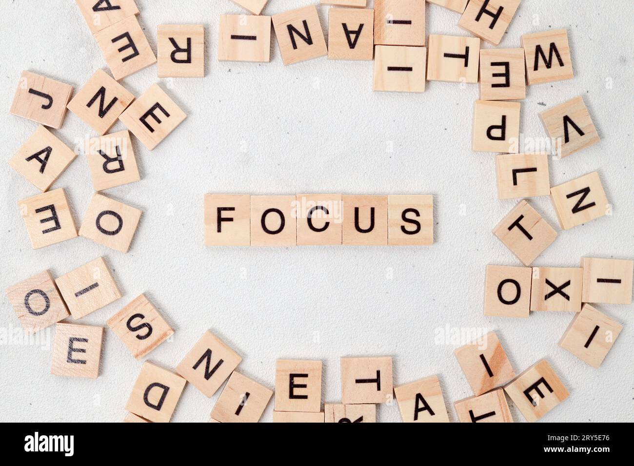 Top view of Focus word on wooden cube letter block on white background ...
