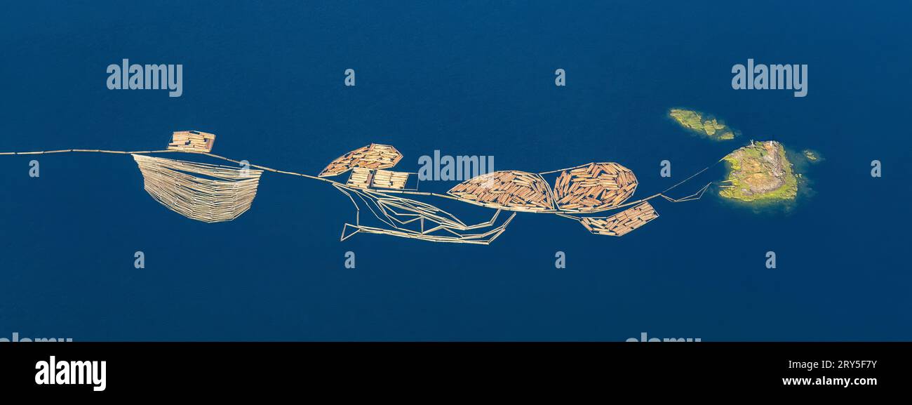 Aerial view of the Lumber wood in the sea attached to a rock island ...