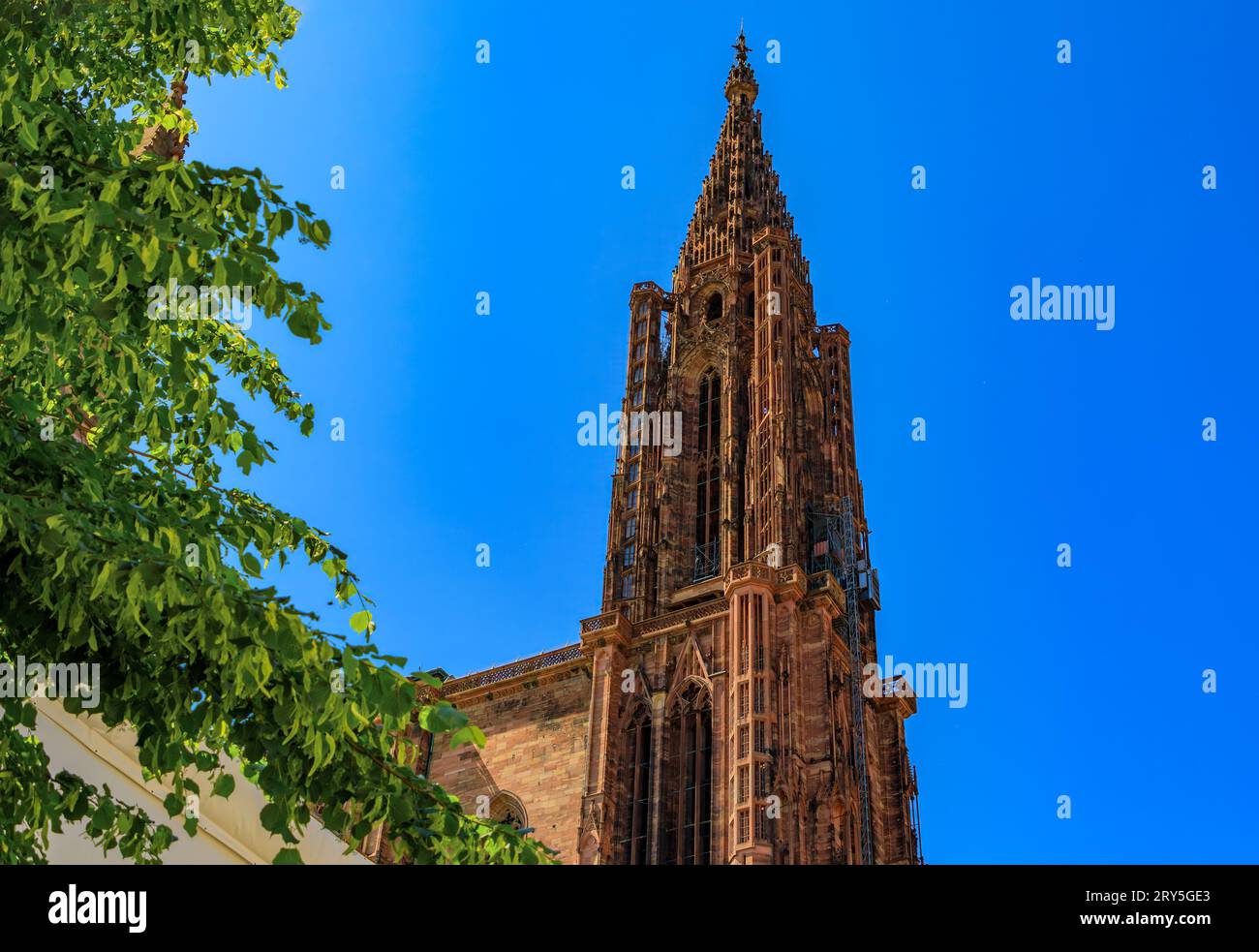 Grande Ile city skyline through a window, tiled roofs and spires of ...
