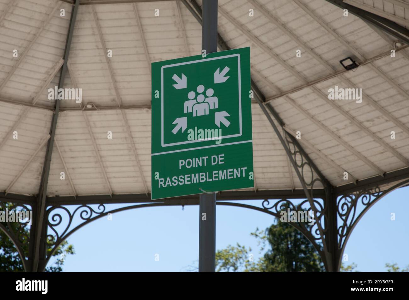 Point de rassemblement french text sign means Emergency assembly point ...