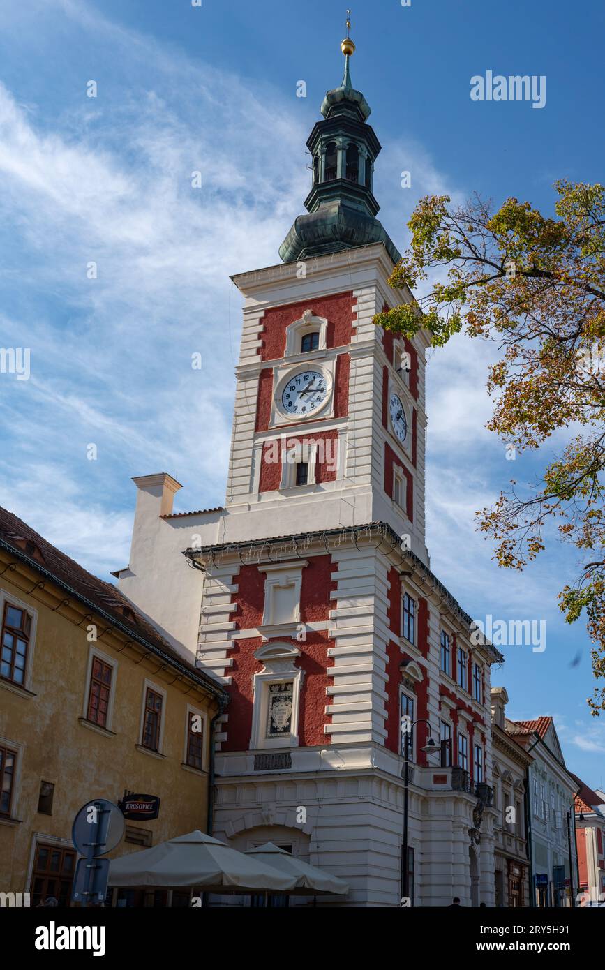 Tower of historic townhouse in Czech town of Slaný. Red and white ...