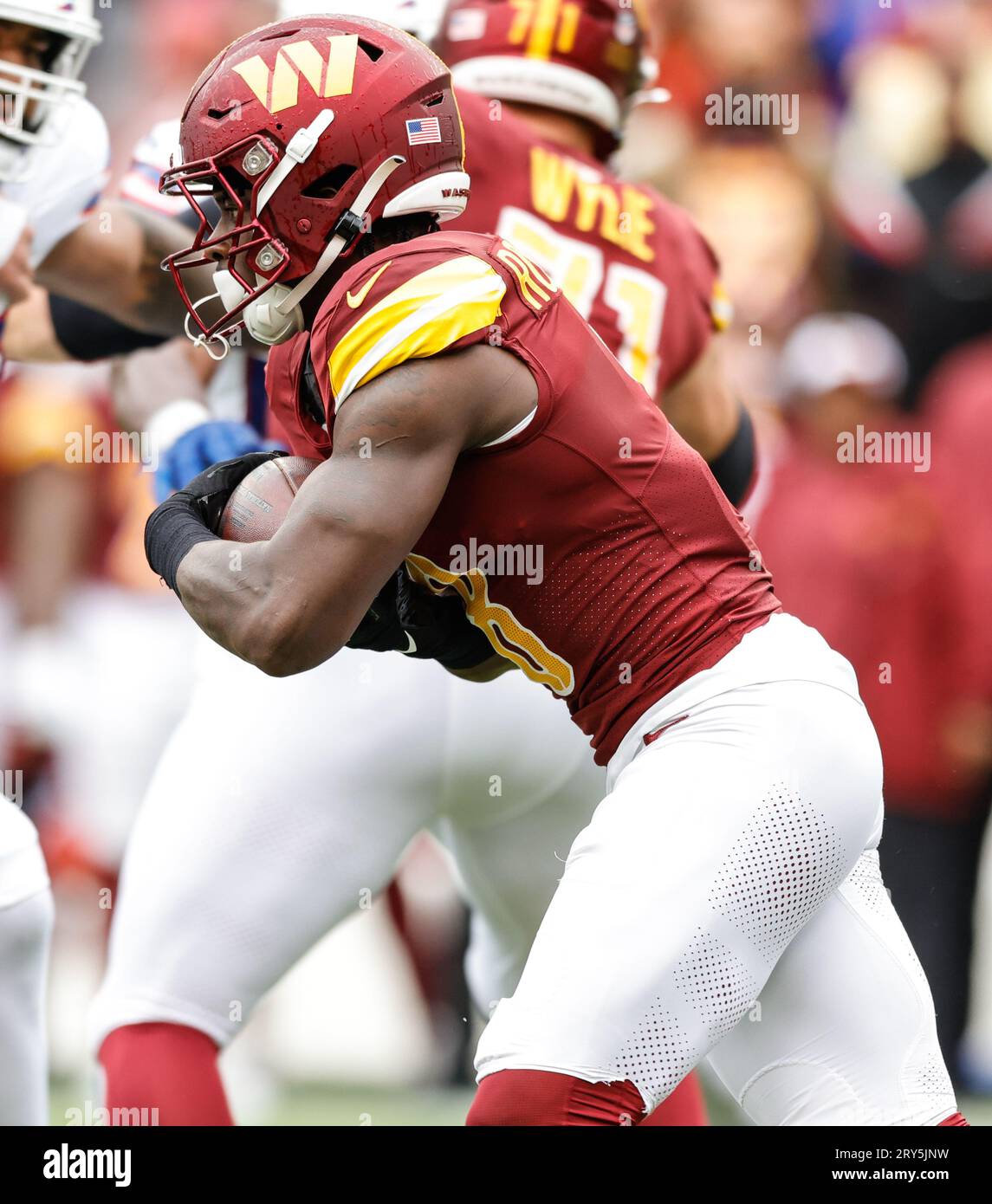 Washington Commanders running back Brian Robinson Jr (8) with the carry ...