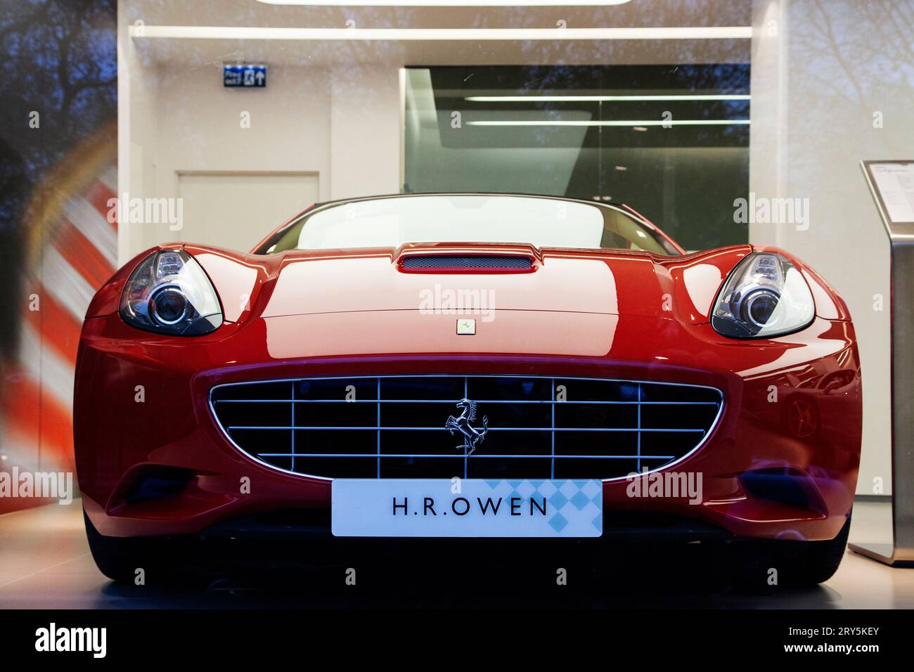 luxury red Ferrari car in H R Owen shop window in London November 2013 ...