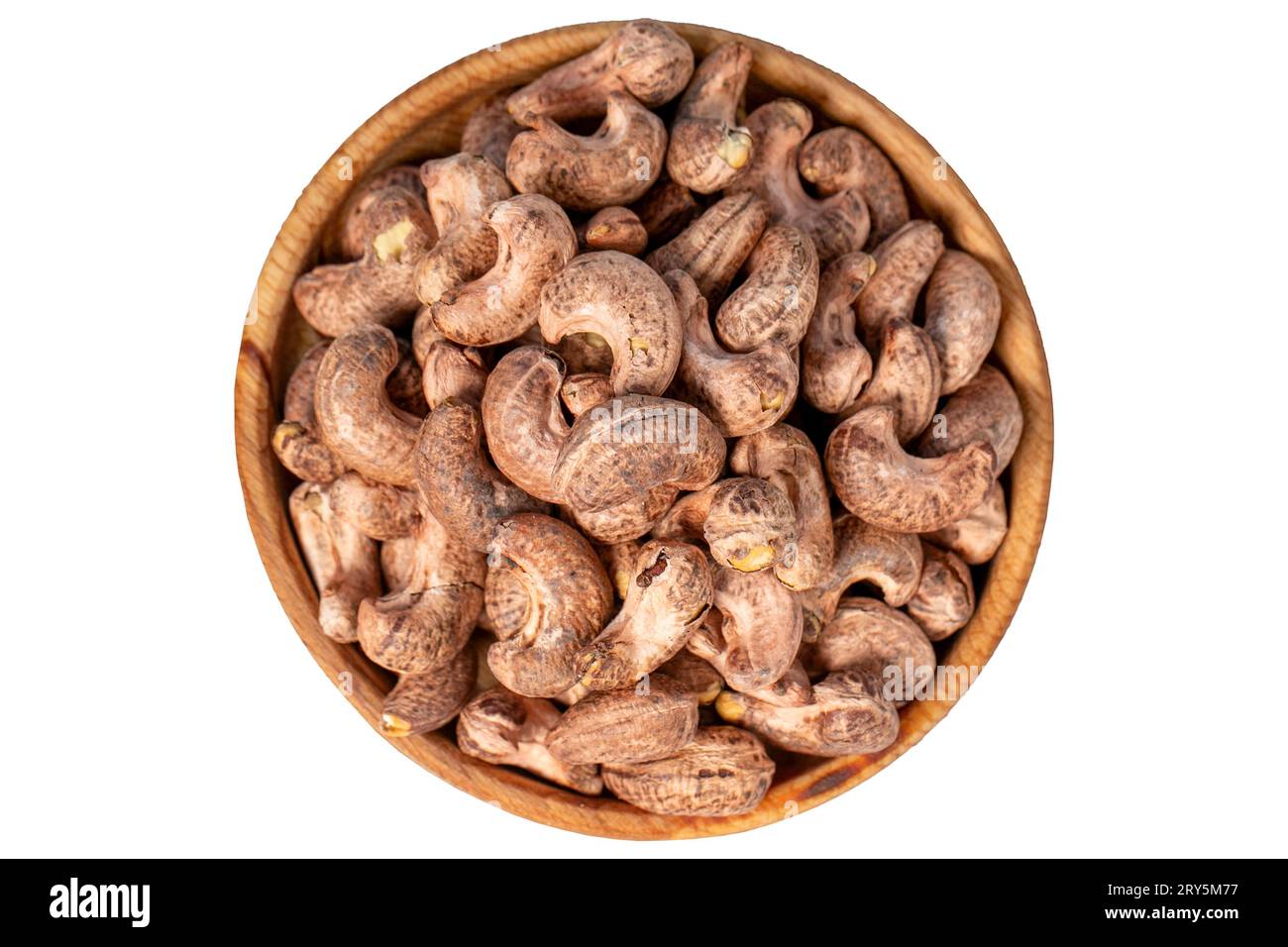 Cashews with shell in wood bowl. Shelled cashew isolated on white ...