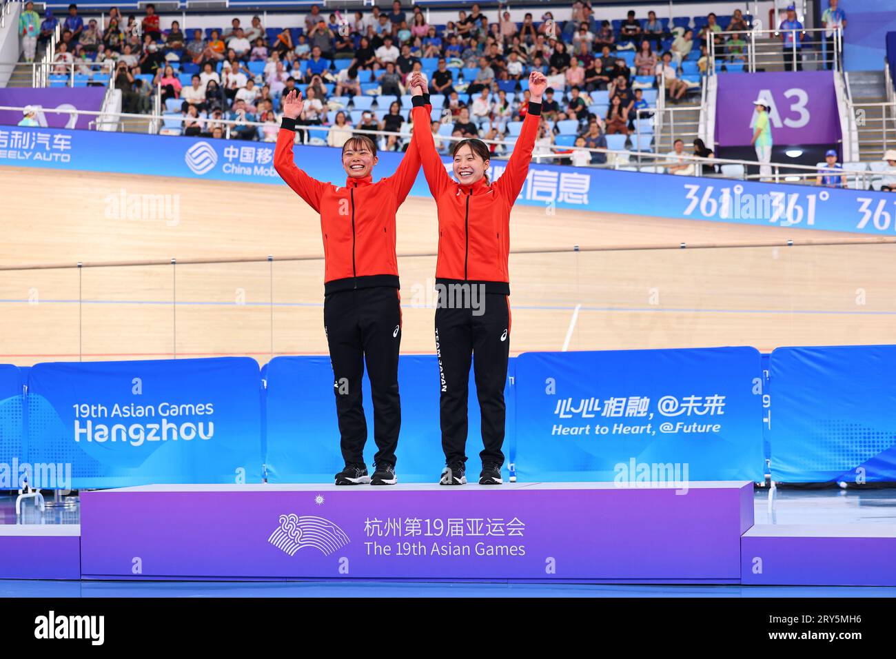 Winner Team Japan Maho Kakita (L), Tsuyaka Uchino (R), on the podium ...