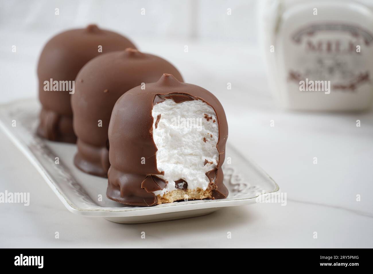 Chocolate-coated marshmallow. Krembo on the table with a cookies ...