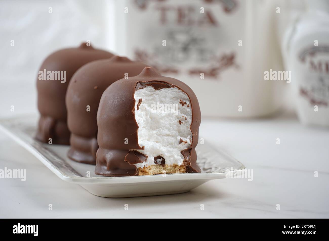 Chocolate-coated marshmallow. Krembo on the table with a cookies ...