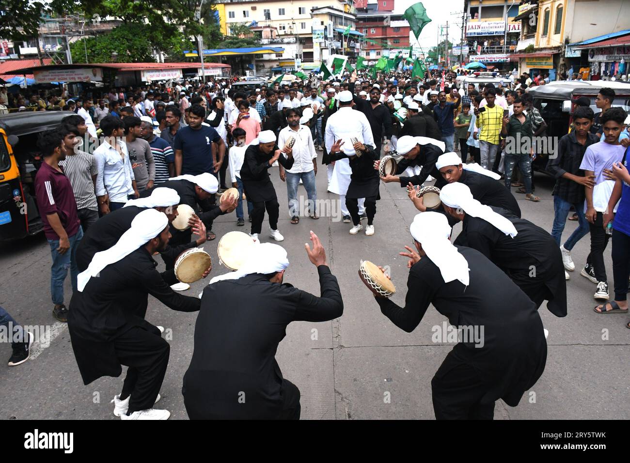 A group of muslim boys performing on duff on the occassion of eid milad ...