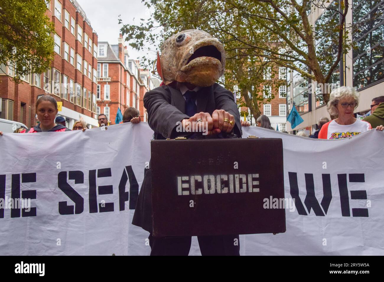 London, England, UK. 28th Sep, 2023. Activists wearing fish masks stage ...