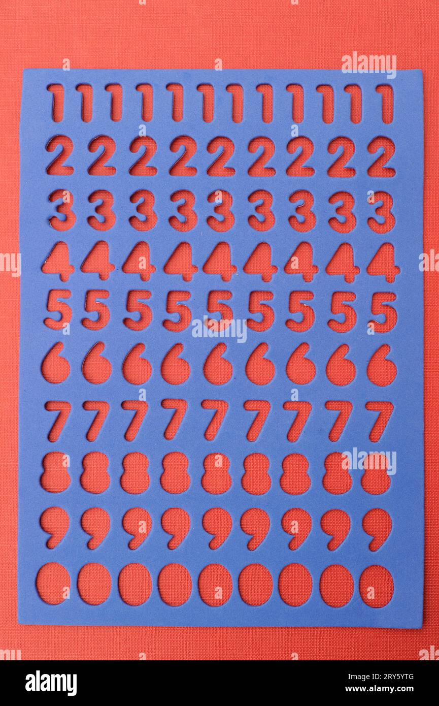 numbers cut out from a molding gum blue plate Stock Photo - Alamy