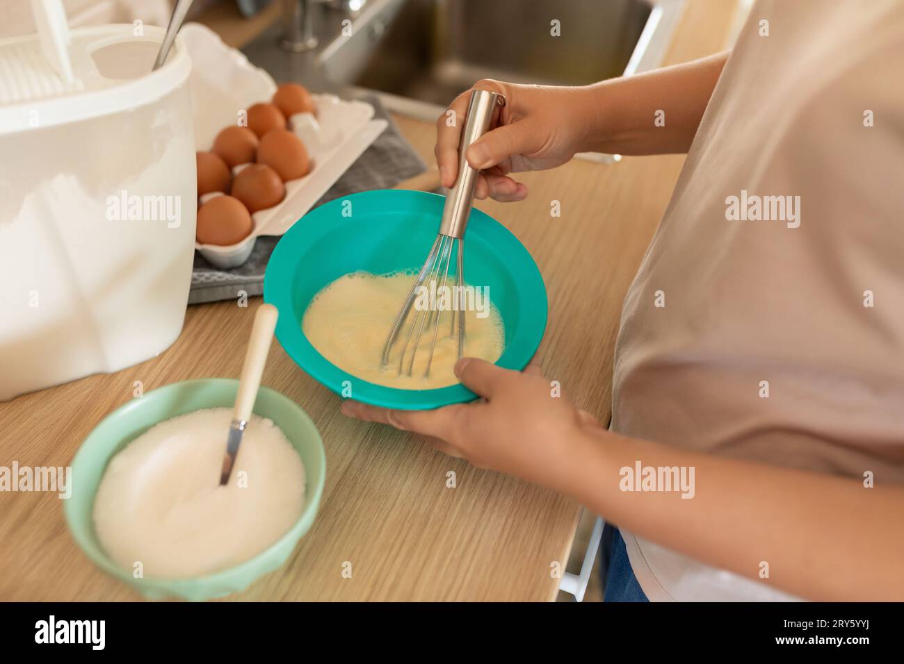 the process of kneading the liquid dough in a bowl Stock Photo - Alamy