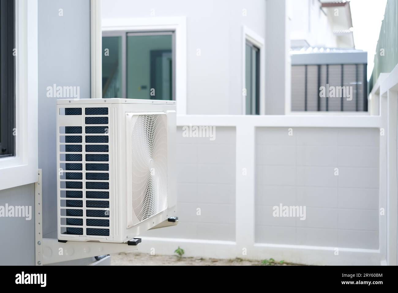 Air conditioner compressor installed outdoors hi-res stock photography ...