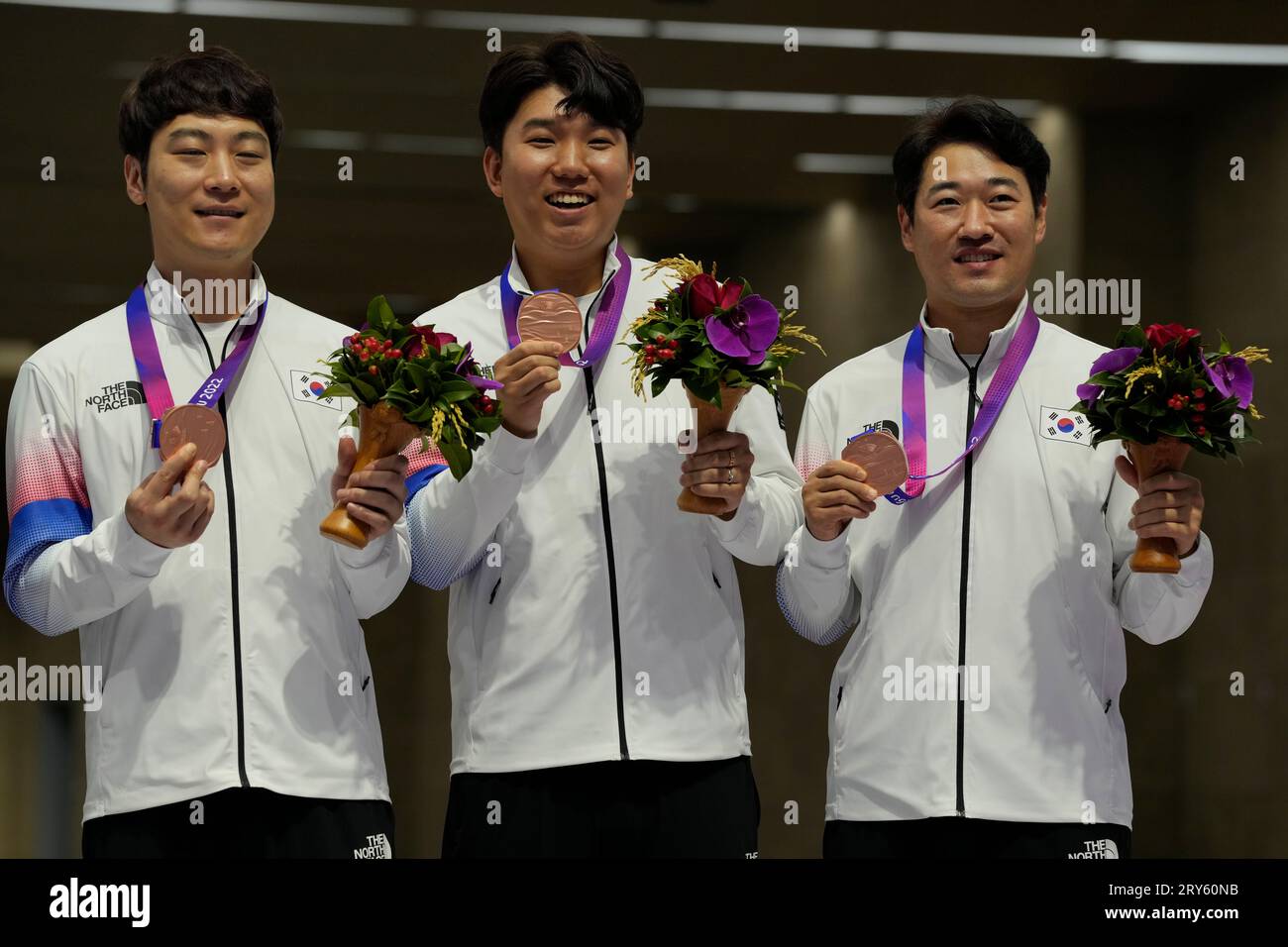 Bronze medalists South Korea's Kim Sangdo, Kim Jonghyun and Mo Daiseong ...
