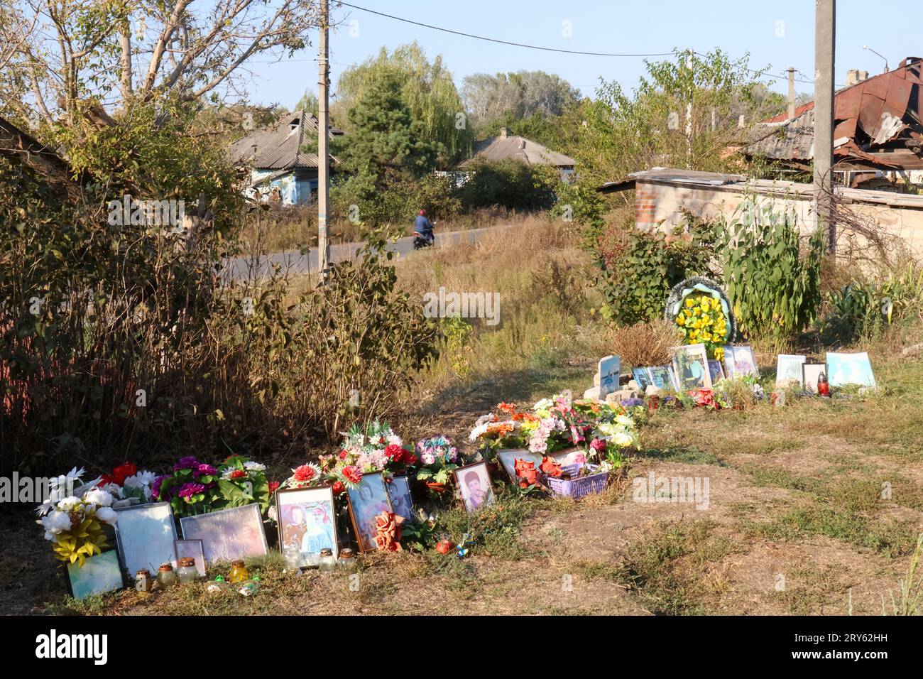 IZIUM, UKRAINE - SEPTEMBER 26, 2023 - Flowers lay at the portraits of ...