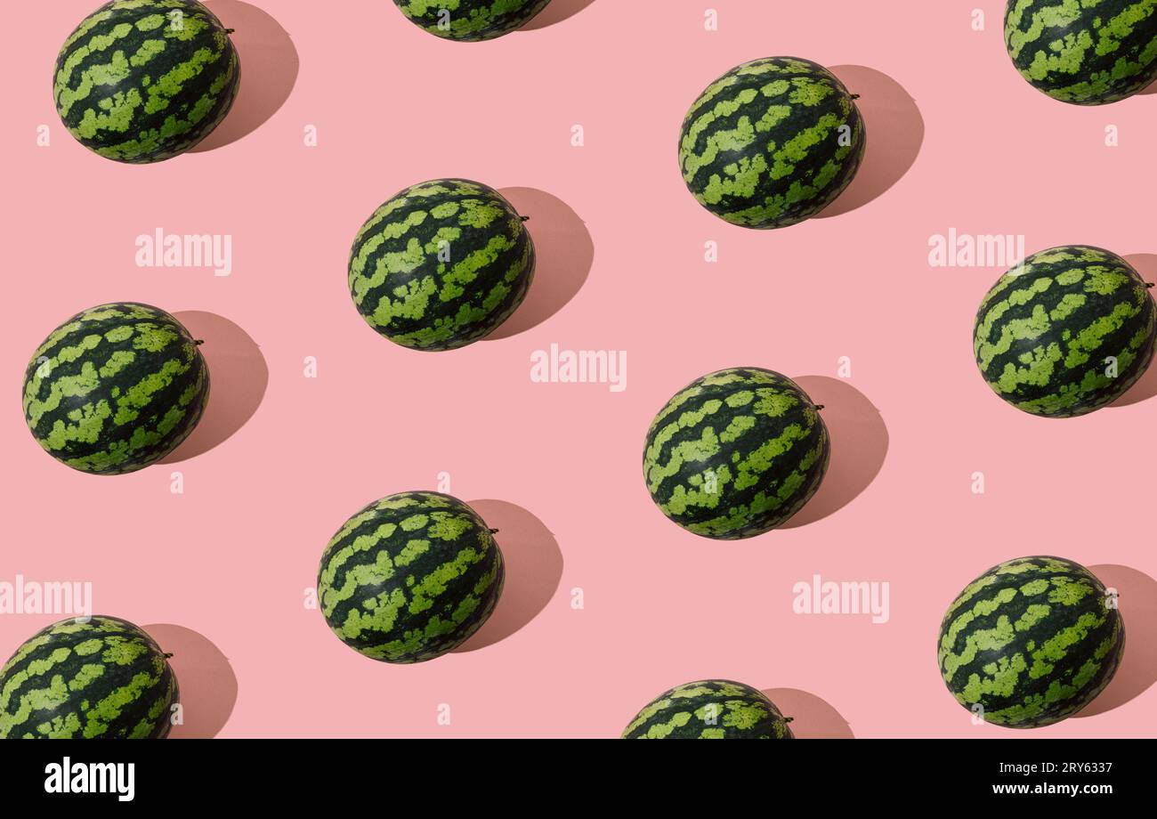 Summer fruit pattern made of green watermelon on light pastel pink ...